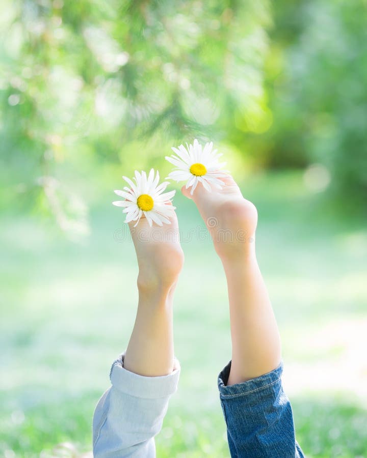 Children`s Feet with Flowers Stock Photo - Image of enjoying, green ...