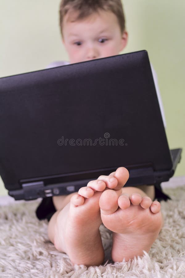 Children& X27;s Feet and Laptop Stock Photo - Image of excitement ...