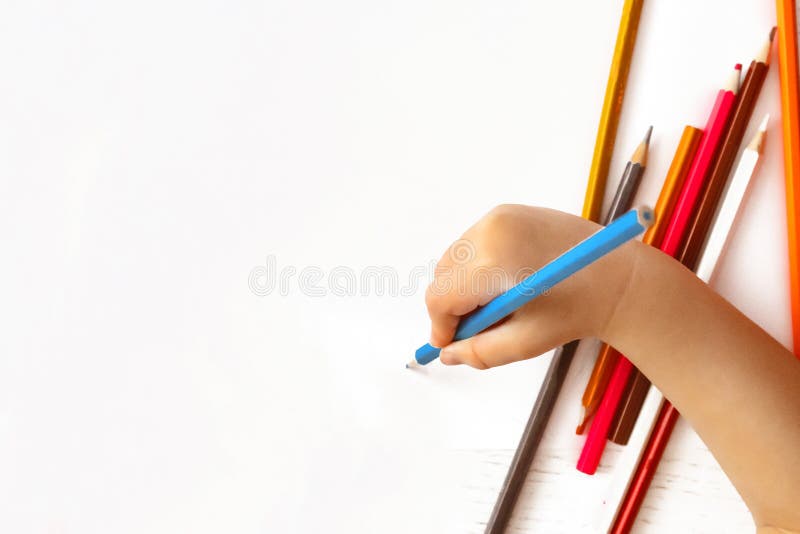 Children`s Hand Draws a Pencil on White Paper. Stock Photo - Image of ...