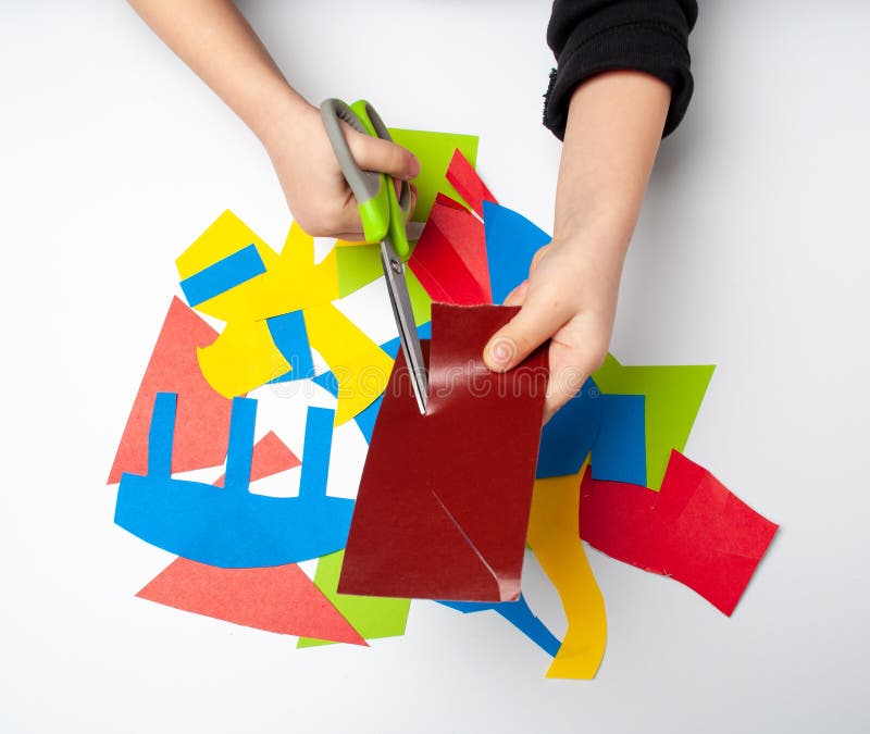 Children`s Hands Cut Colored Paper on a White Background Stock Photo ...