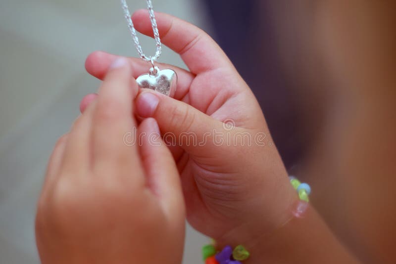 Young Boy's Hand Holding Chain Stock Photos - Free & Royalty-Free Stock ...