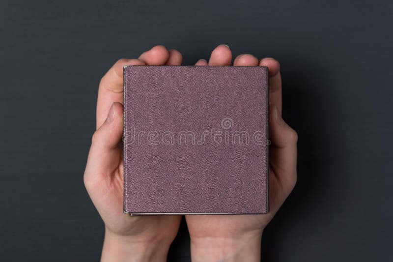 Children`s Hands Holding Small Gift Box on White Background. Top View ...