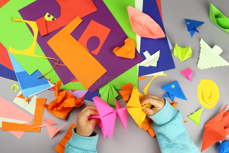 Children S Hands Make Origami Crafts from Colored Paper Stock Photo ...