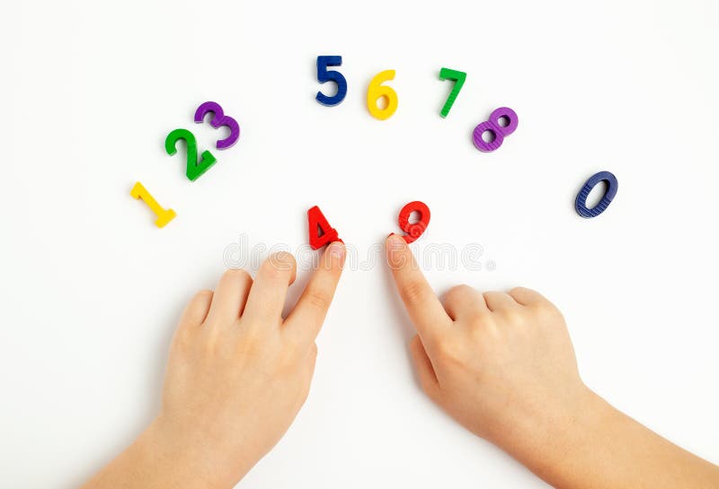Children& X27;s Hands Move Numbers on a White Table. Learning Colors ...