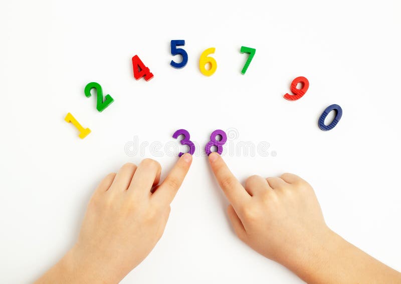 Children S Hands Move Numbers on a White Table. Learning Colors and To ...