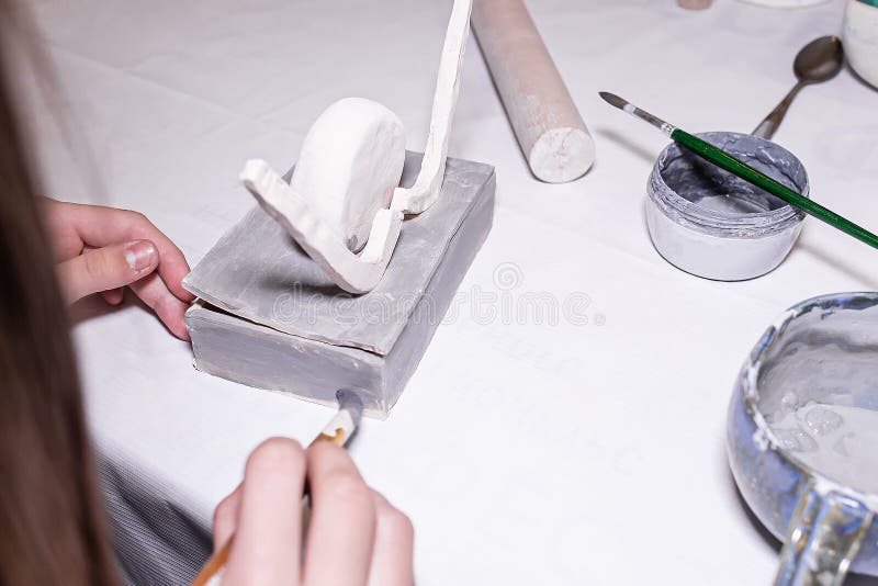 Children`s Hands in a Pottery Art Workshop Draw Their Work from Ceramic ...