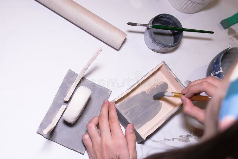 Children`s Hands in a Pottery Art Workshop Draw Their Work from Ceramic ...