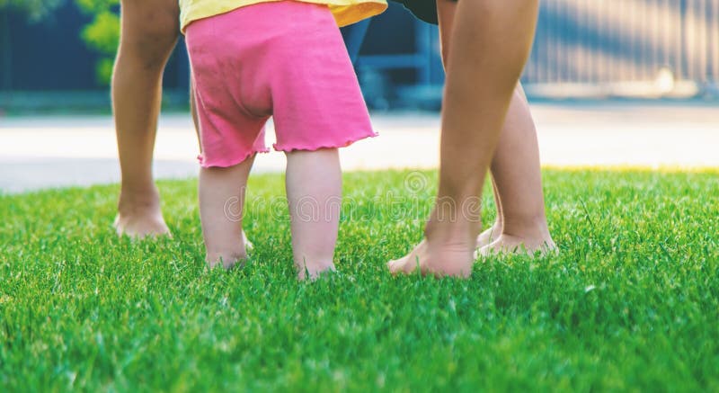 Children& X27;s Legs Run on Green Grass. Children Stock Photo - Image ...