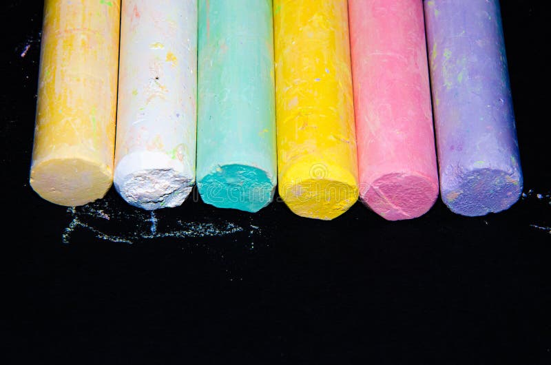 Children`s Multicolored Crayons on a Black Background. Chalk for ...