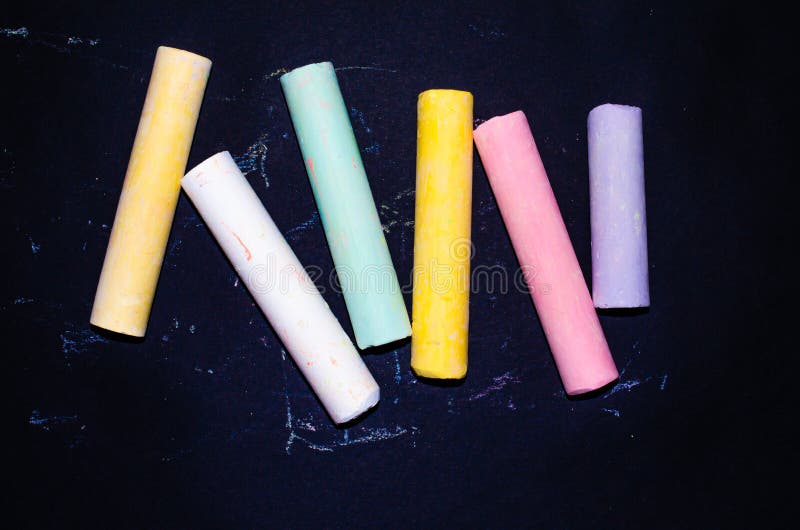 Children`s Multicolored Crayons on a Black Background. Chalk for ...
