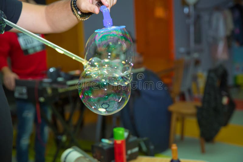 Children`s Party. To Burst the Soap Bubble . Soap Bubbles Show Stock ...