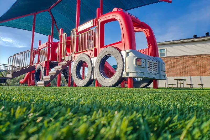 Children S Playground in the Form of a Red Fire Truck and Artificial ...