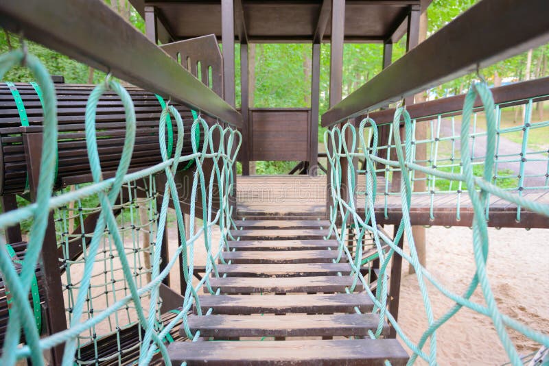 Children`s Playground Made of Wood with a Hanging Bridge Stock Image ...