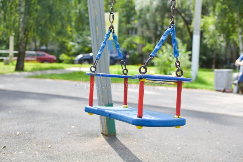 Children`s Playground Outdoor in Summer. Blue Hanging Swing Stock Image ...