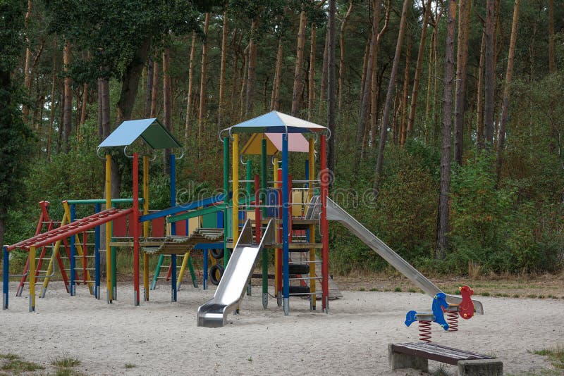 Playground in a Pine Forest Stock Photo - Image of playground, forest ...