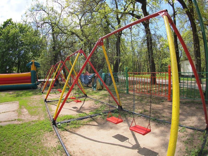 Children S Playground with Swings in the Park Stock Image - Image of ...