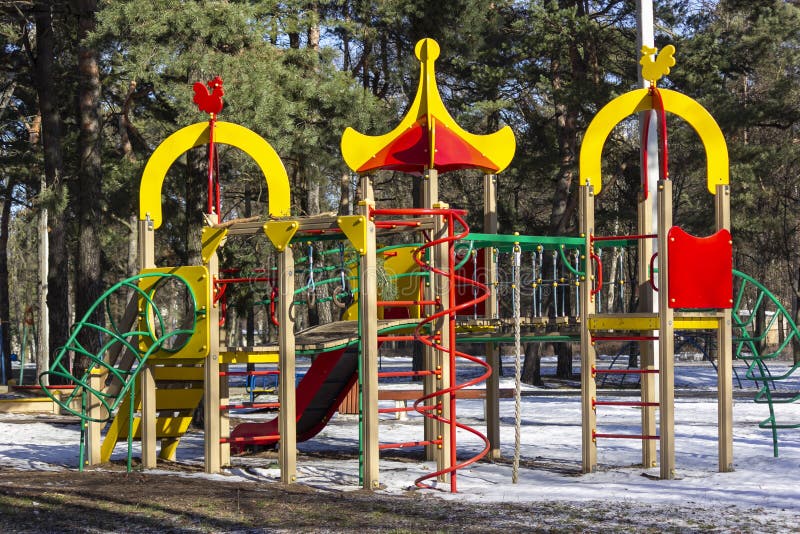 Children S Playground in Winter among Coniferous Trees. during the Cold ...