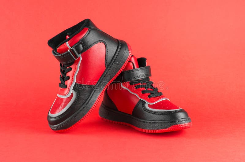 Children S Red-black Sneakers. Children S Shoes Stock Image - Image of ...