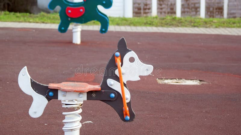 Children`s Swing in the Form of Animals on the Site Stock Photo - Image ...