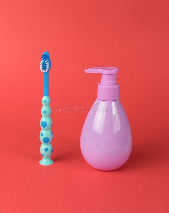 Children S Toothbrush and Original Toothpaste on a Red Background Stock ...