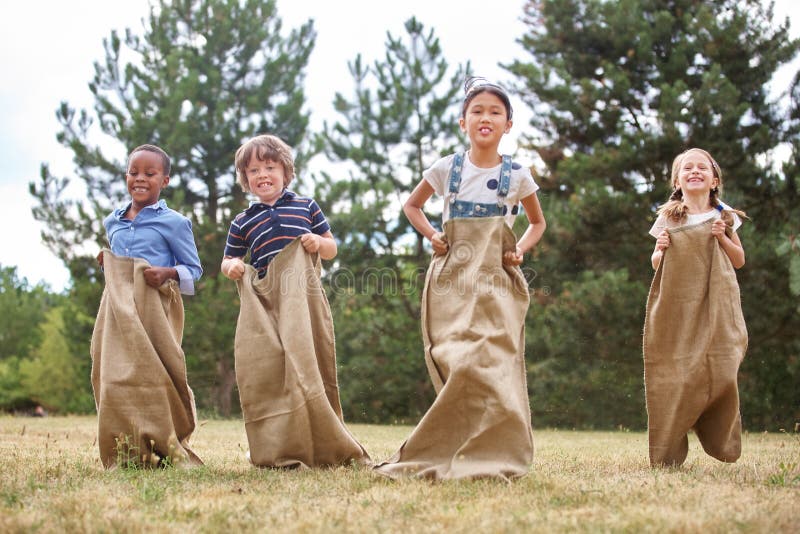 Children in Potatoe Sack Race Editorial Photography - Image of town ...