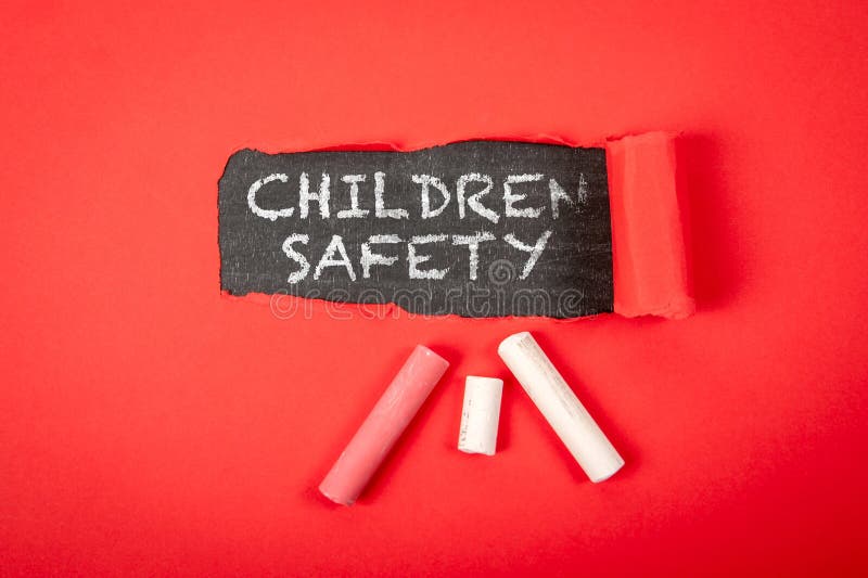 Children Safety. Text Under Torn Red Paper on a Blackboard Stock Image ...