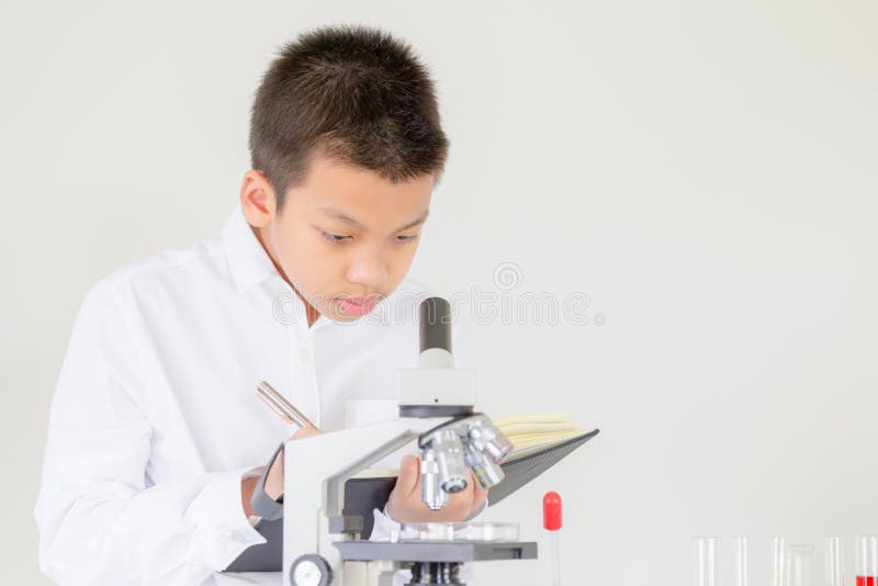 Children Science Concept, Portrait of Kid Boy Using Microscope in ...