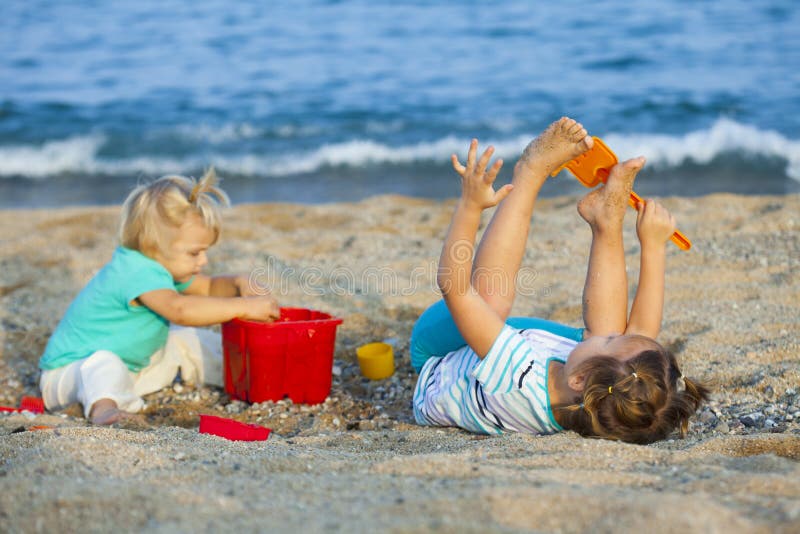 Children At The Seaside Playing Stock Image - Image of play, blue: 46794903