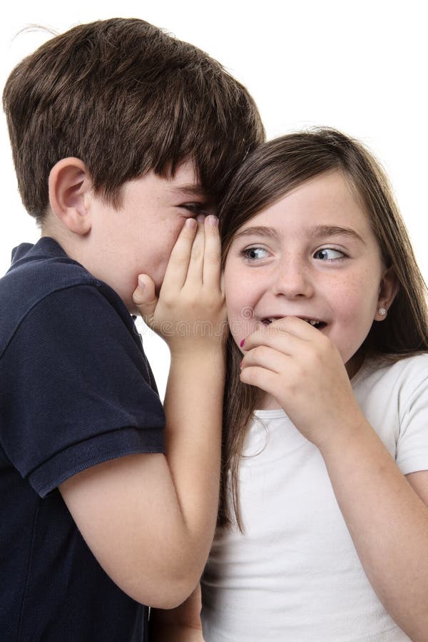 Children sharing a secret stock photo. Image of isolated - 64567282