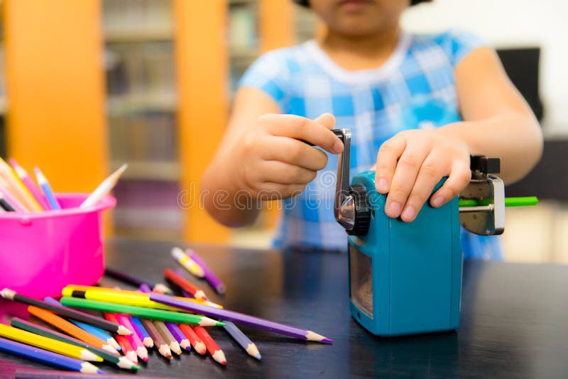 Children are Sharpening Crayons in the Library Stock Photo - Image of ...