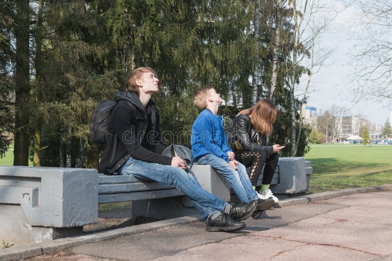 Children Sit on a Bench in the Park Stock Photo - Image of diversity ...