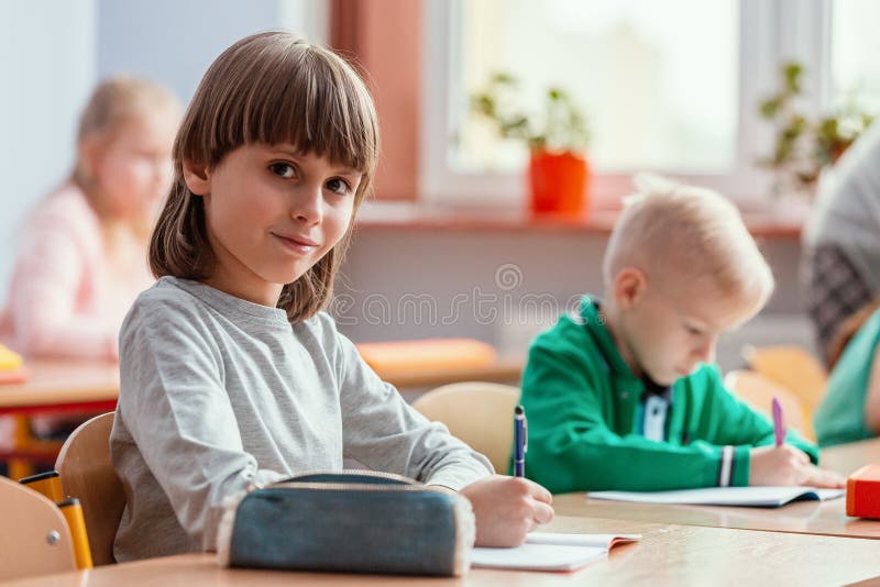 Children Sit at the Tables in the Classroom Stock Photo - Image of ...