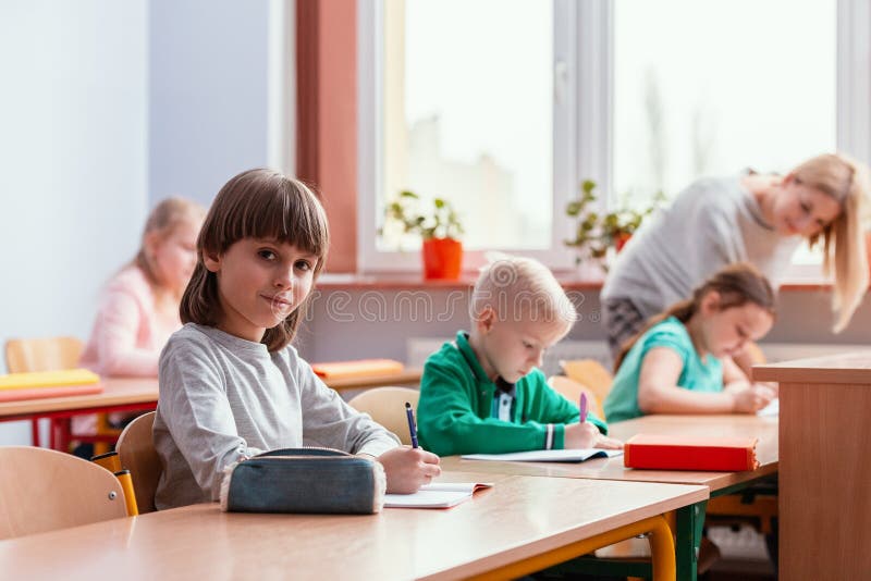 Children Sit at the Tables in the Classroom Stock Photo - Image of ...