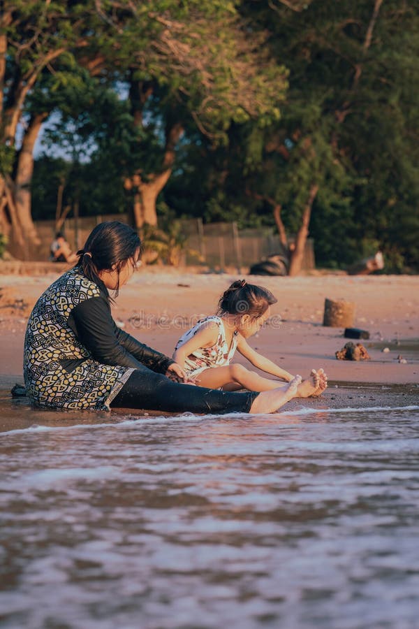Children Sitting by the Beach Playing Sand Stock Image - Image of child ...