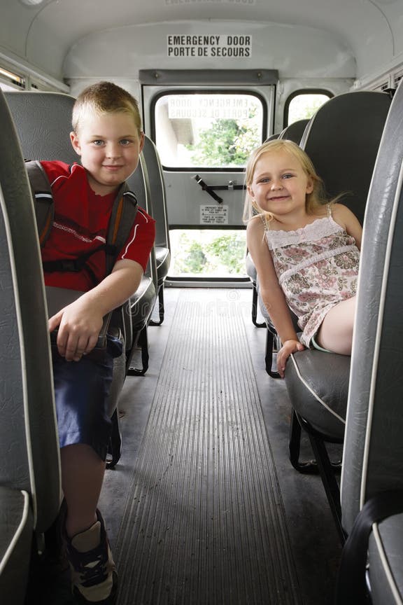 Children Sitting in a School Bus Stock Image - Image of sitting, young ...