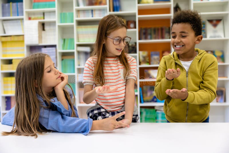 144 School Kids Sitting Table Library Lesson Stock Photos - Free ...