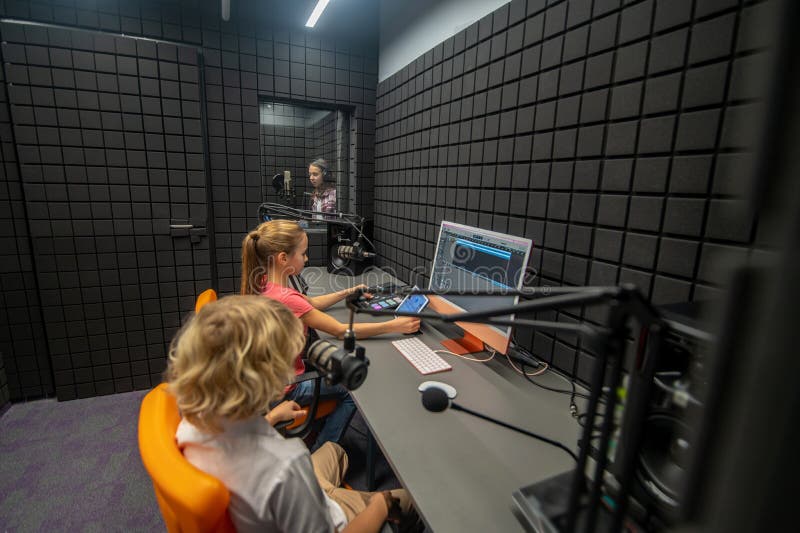 Children Sitting at the Studio Desk during Sound Recording Stock Photo ...