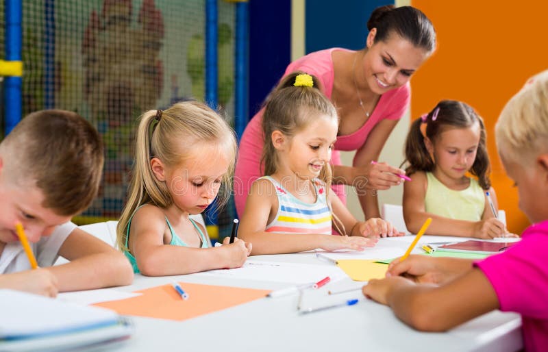 Children Sitting Together and Drawing in Class at School Stock Image ...