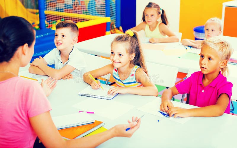 Children Sitting Together and Studying in Class at School Stock Photo ...