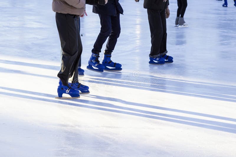 Children Skating. Long Evening Shadows on the Ice Stock Image - Image ...