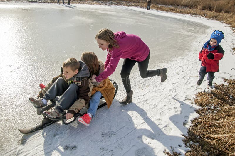 Children playing on ice stock photo. Image of sled, running - 39540670