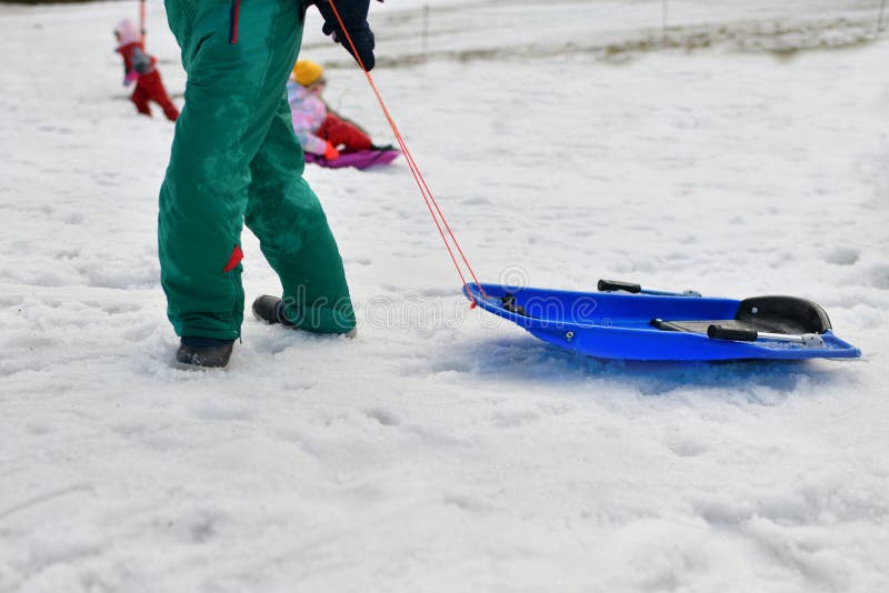 A Children Sledding in the Snow in Winter Stock Image - Image of season ...