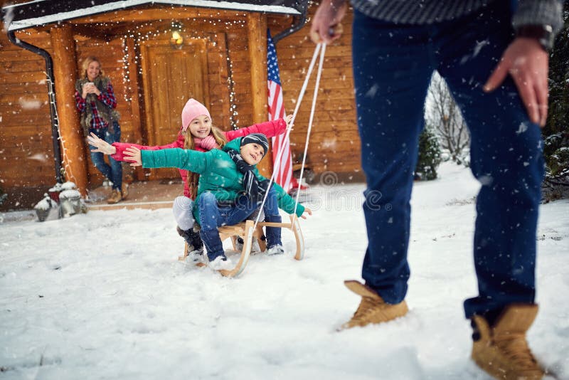 Children Sledding at Winter Time Stock Image - Image of playful ...