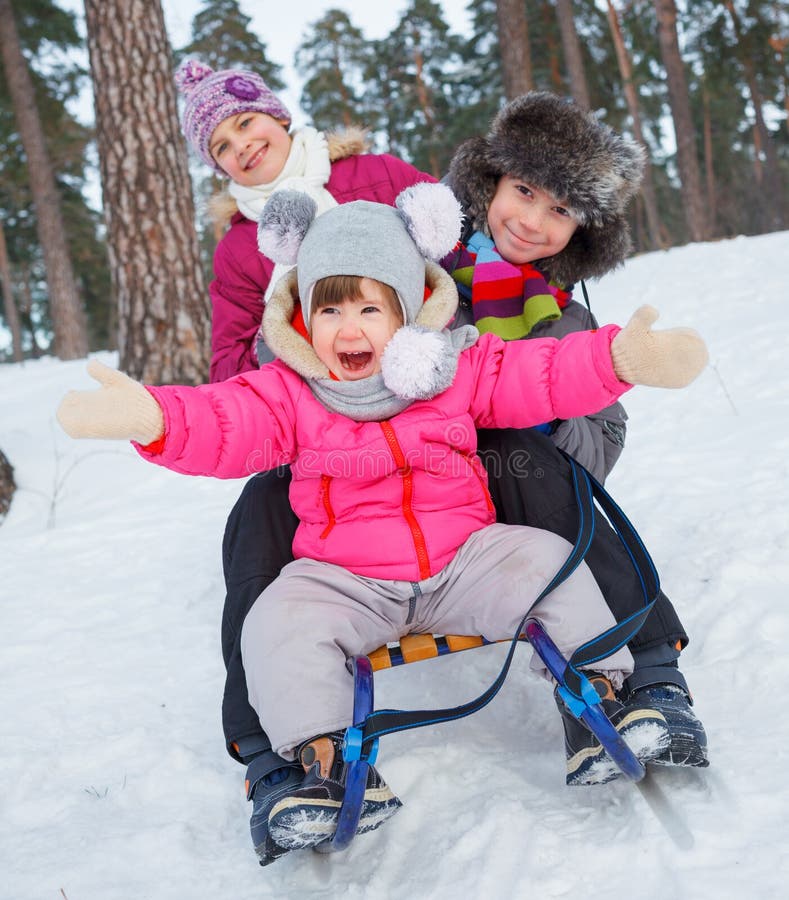 Kids Play in Snow. Winter Sleigh Ride for Children Stock Photo - Image ...