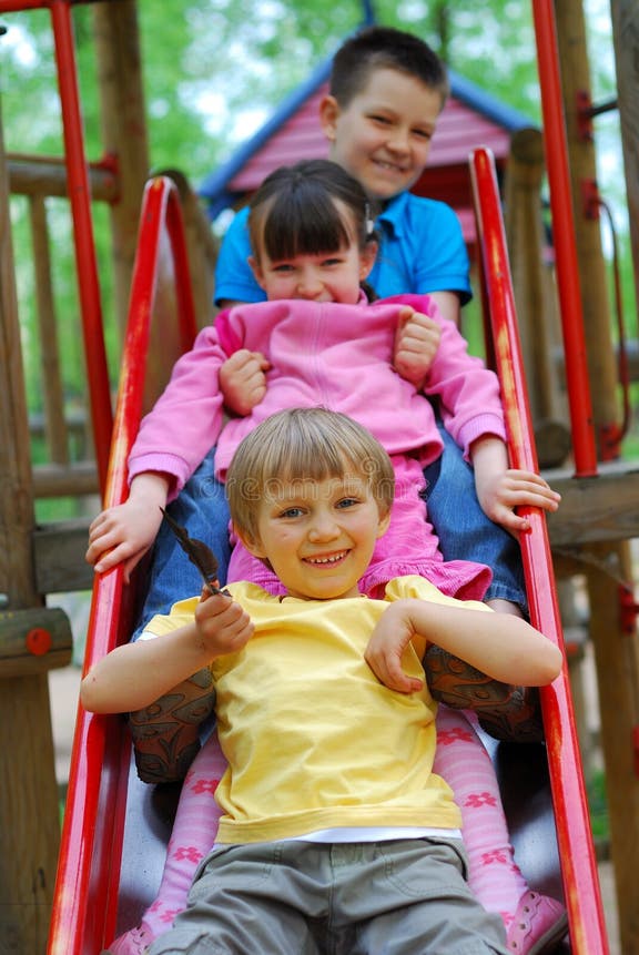 Children on Slide stock photo. Image of park, three, family - 2402442