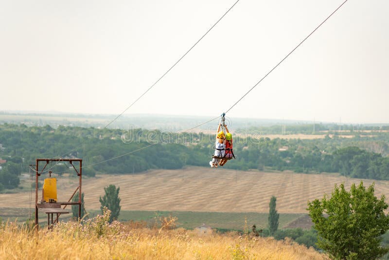 Children Slide Along the Rope in the Park on the Rides Stock Image ...