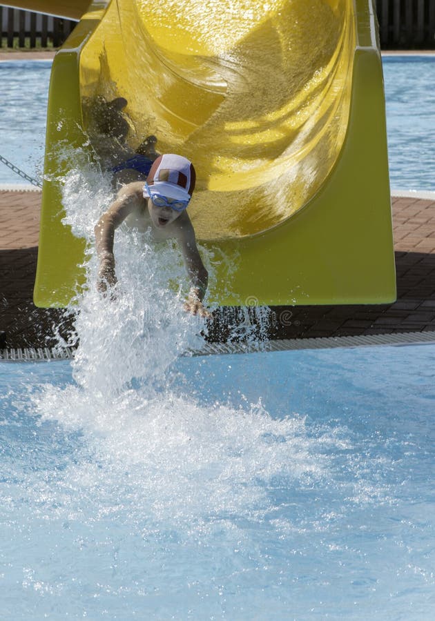 Children Slide Down a Water Slide Stock Photo - Image of vacation ...