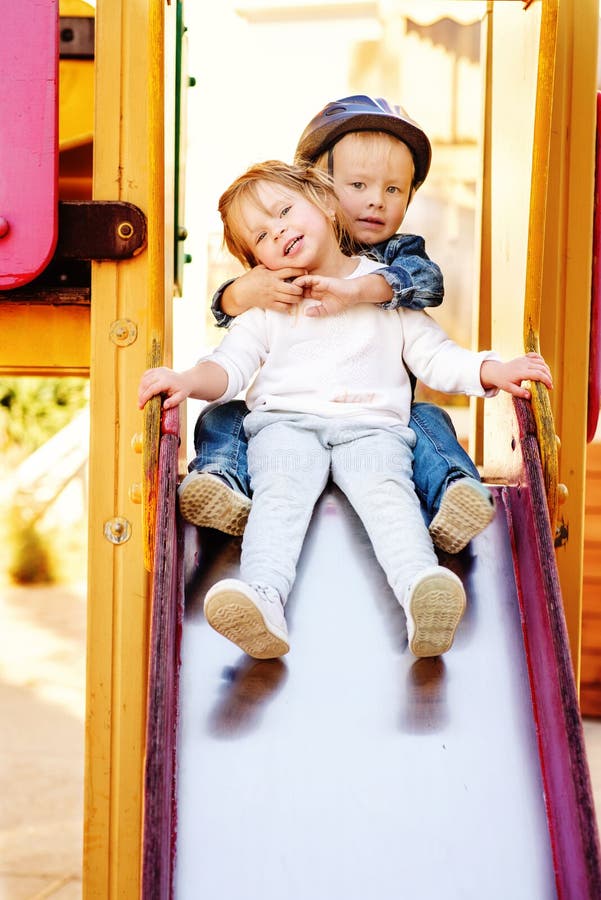 Children on the slide stock photo. Image of nursery - 200374642
