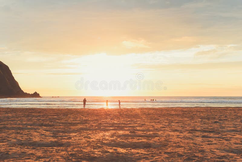 Children and Small Group of People Splashing in the Sea and Having Fun ...