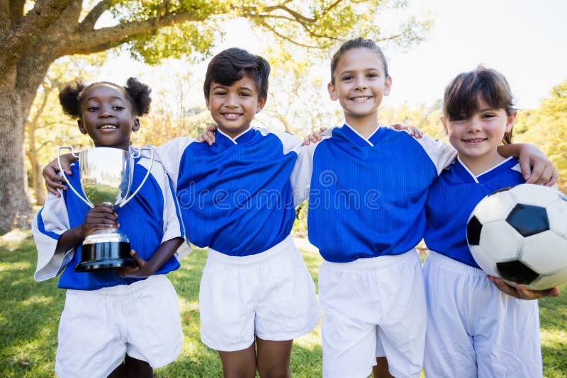 Children Soccer Team in Raw Smiling Stock Photo - Image of balloon ...